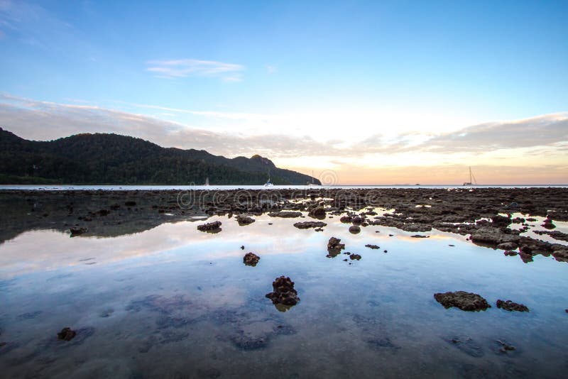 Dawn at Datai Beach stock photo. Image of boats, east - 66608806