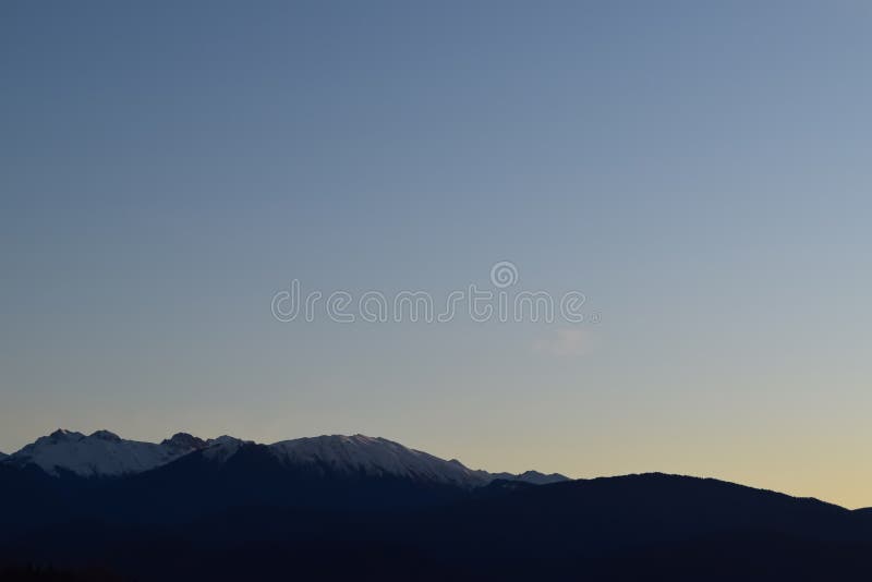 Dawn Over the Mountains. Dark Silhouette of Mountains Against the Sky ...