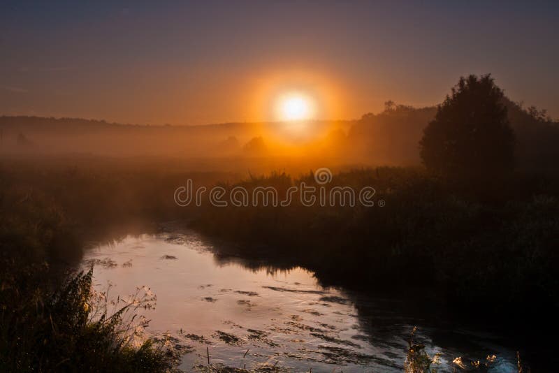 Dawn, the Sun Rises Over the River and Darkened Scenery, Bright Stock ...