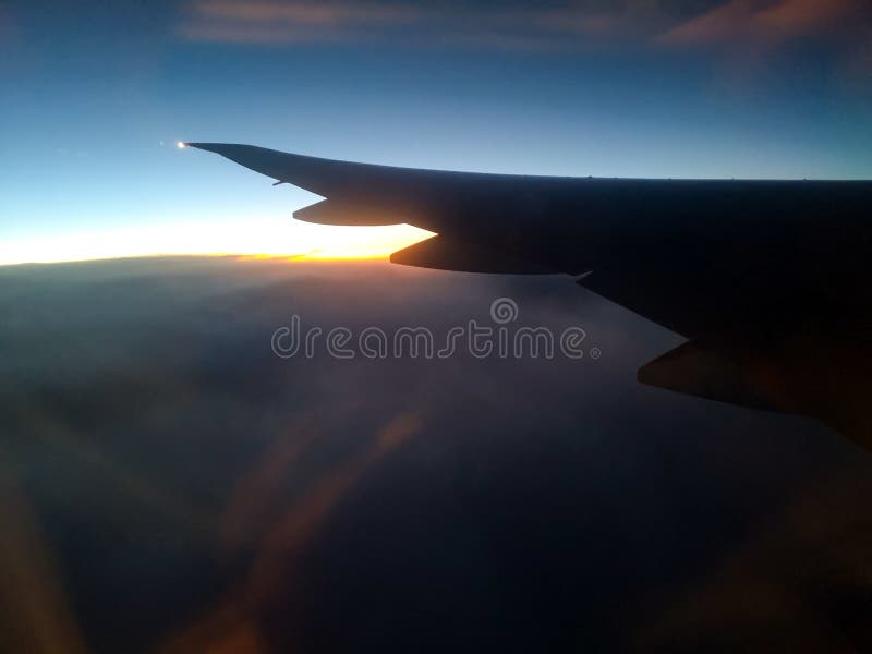 Dawn of the Sun in the Window of an Airplane Stock Photo - Image of ...