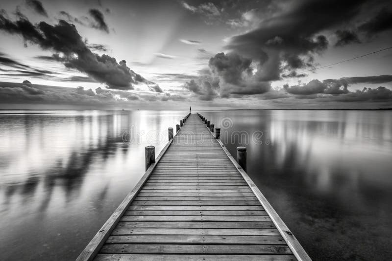 Dawn on Wooden Jetty in Black and White for Inspirational Design Stock ...