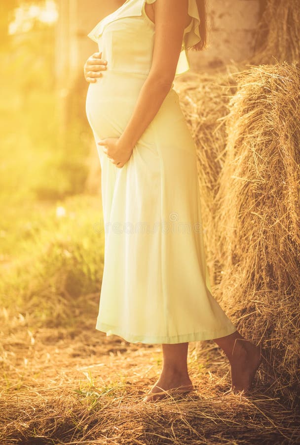 Close-up Pregnant Belly with Stretch Marks of Gravid Woman Holding ...