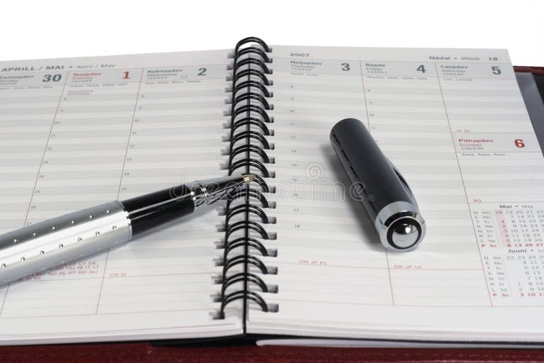 Day planner & pen - 2 stock image. Image of organizer - 2081927