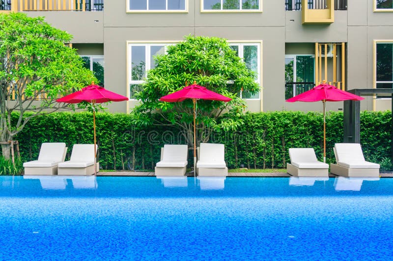 Daybed by the Pool with Residents. Stock Image - Image of outside, bath ...