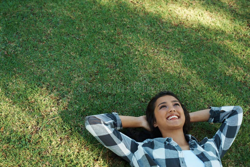 Daydreaming In The Sun A Beautiful Young Woman Lying On Her Back In