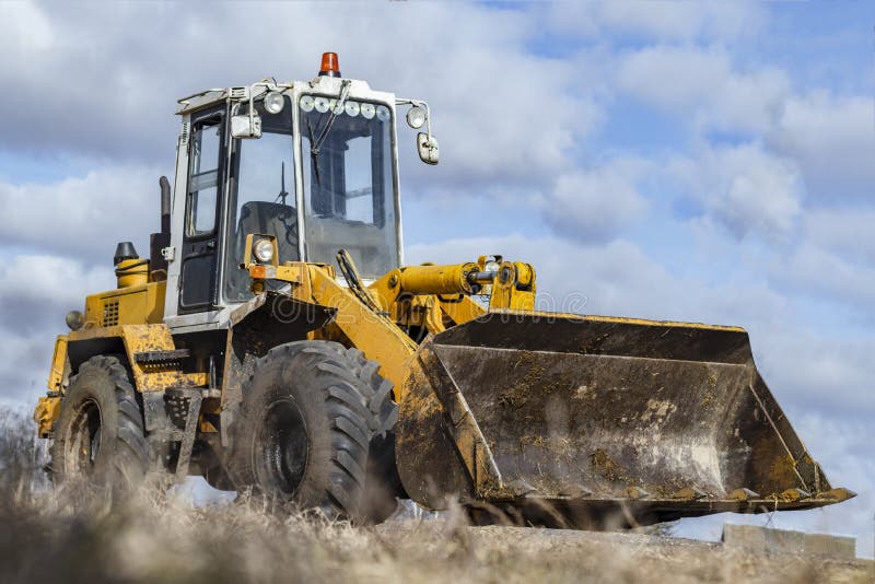 Daylight Yellow Loader with a Bucket. There is a Tint Stock Image ...