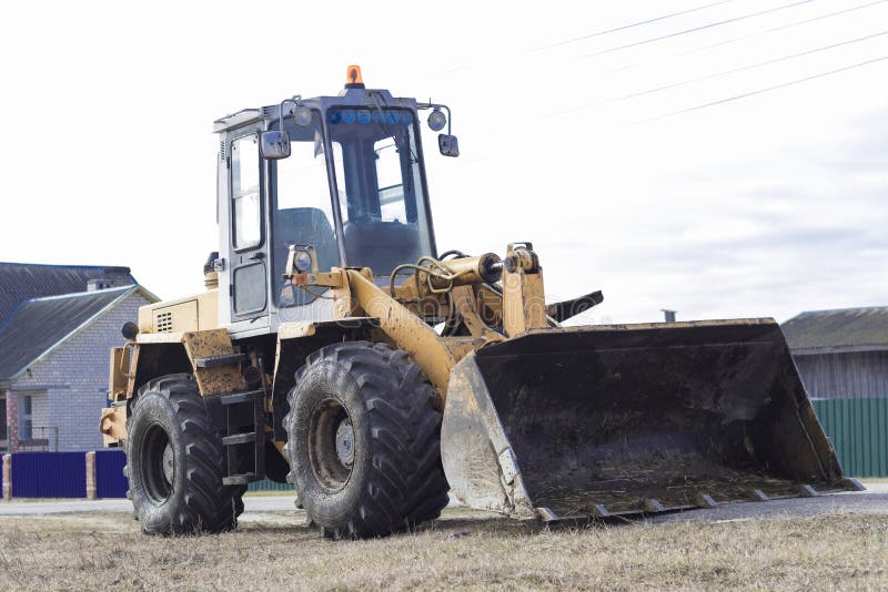 Daylight Yellow Loader with a Bucket. There is a Tint Stock Image ...