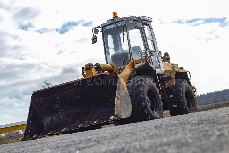 Daylight Yellow Loader with a Bucket. There is a Tint Stock Photo ...