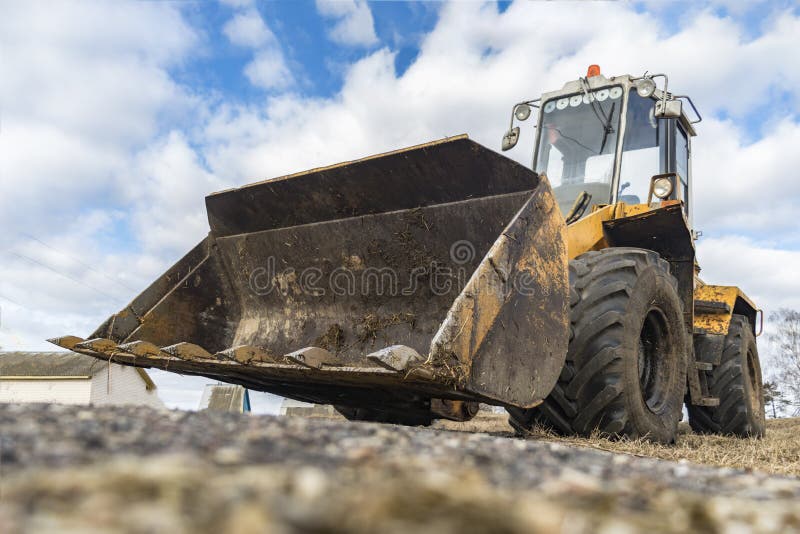 Daylight Yellow Loader with a Bucket. There is a Tint Stock Image ...