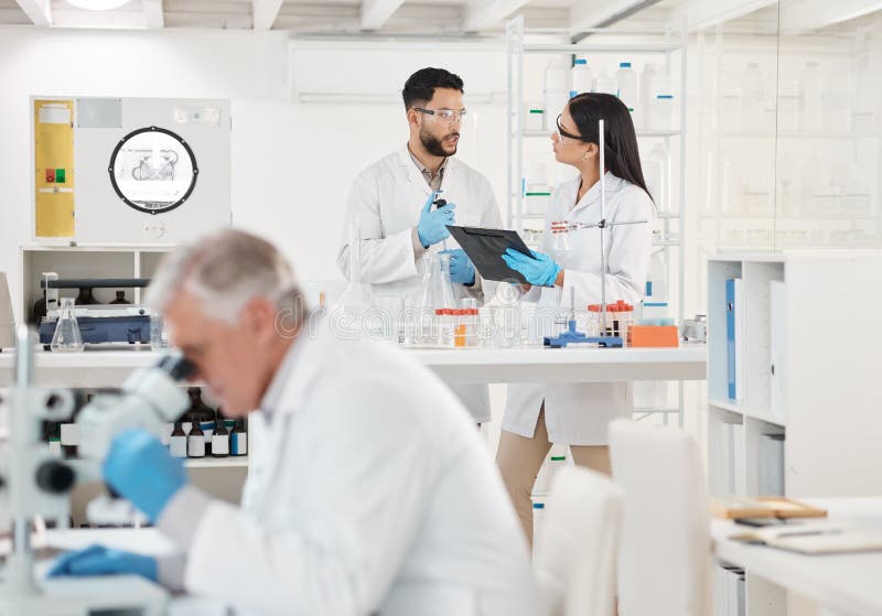 The Days Discoveries are always Interesting. Two Scientists Working ...