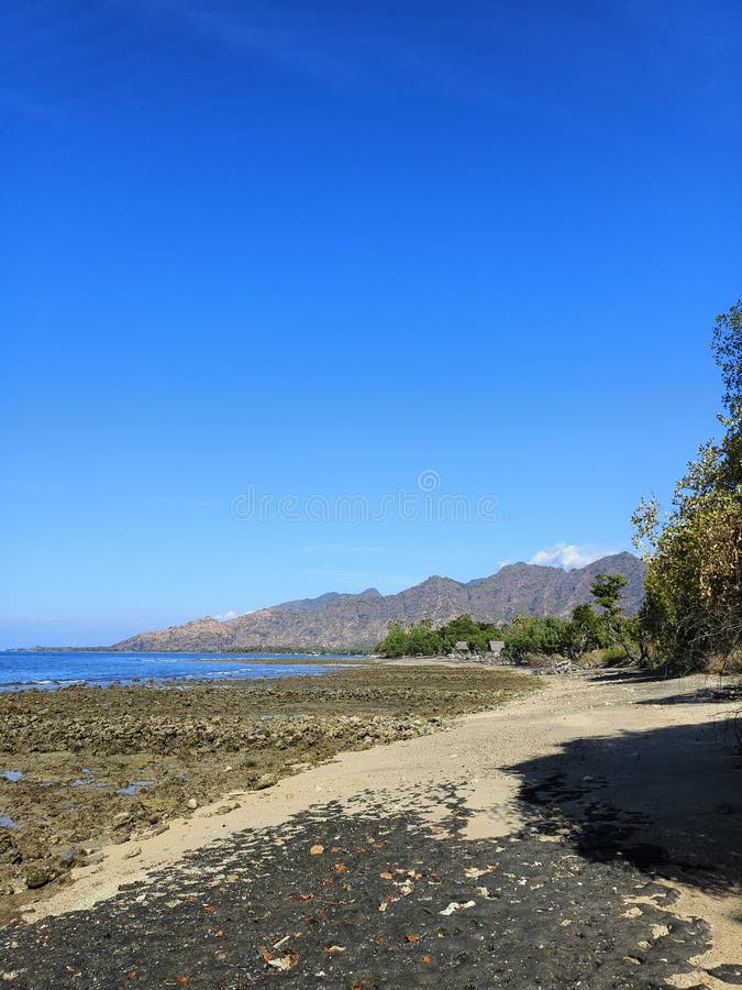 Daytime beach view stock photo. Image of landscape, mountain - 286568312