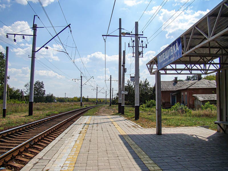 A Daytime Image of a Railway Station with an Empty Platform, Train ...