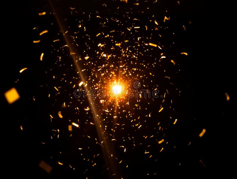 A Dazzling Burst of Golden Sparks Radiating from a Bright Light Source ...