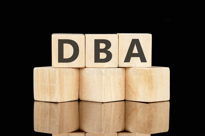 DBA Text Assembled from Wooden Cubes on a Black Background Stock Photo ...