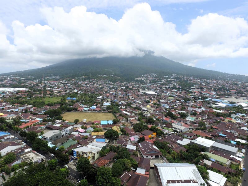 Aerial View of Settlement with Mount Gamalama in the Background ...