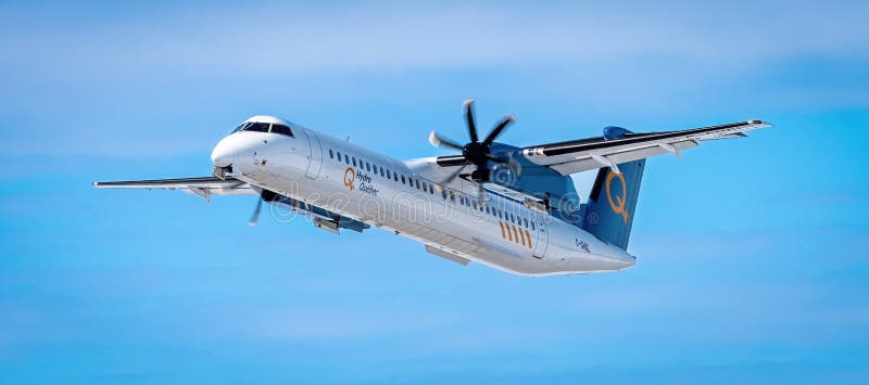 De Havilland Dash 8, in Flight on Sunny Blue Sky Editorial Stock Image ...
