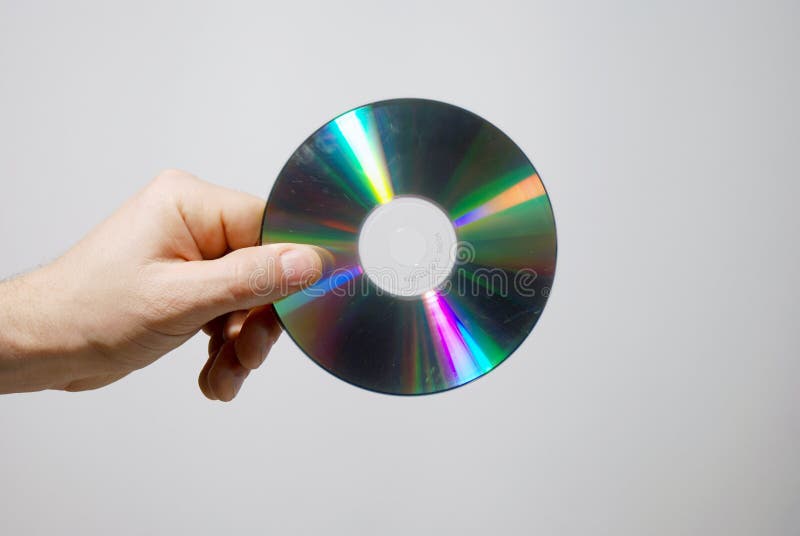 De Holdingscompact-disc /DVD Van De Hand Stock Foto - Image of opslag ...