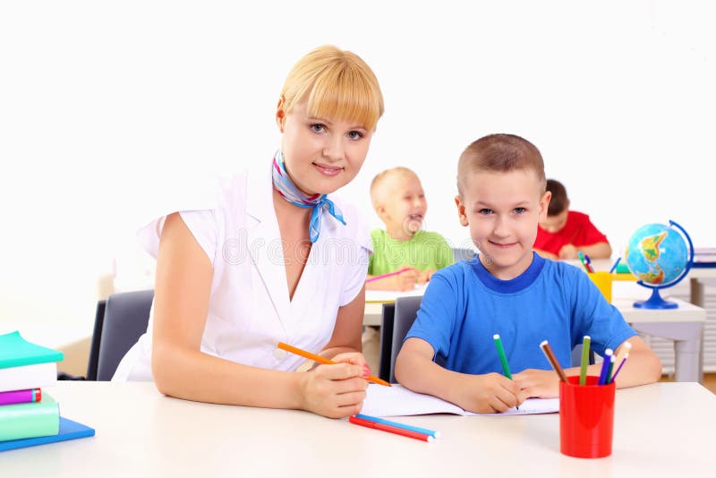 De leraar maakt de lessen stock foto. Image of schoolmeisje - 20260452