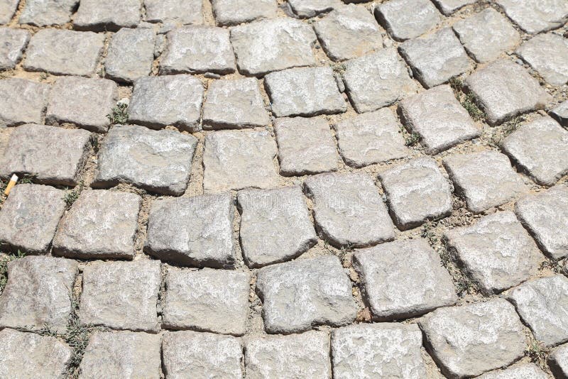 De Textuur Van De Steenweg. Keien. Close-up. Stock Afbeelding - Image ...