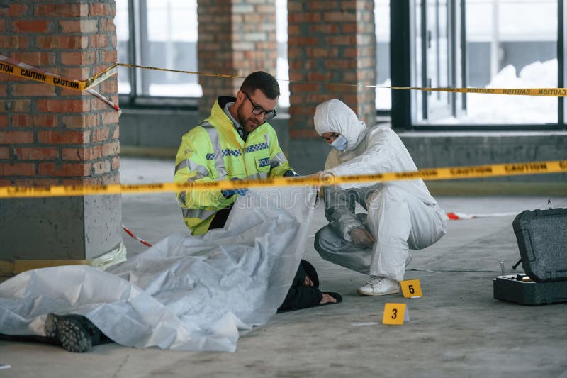 Dead Body Is On The Ground Detectives Are Collecting Evidence In A