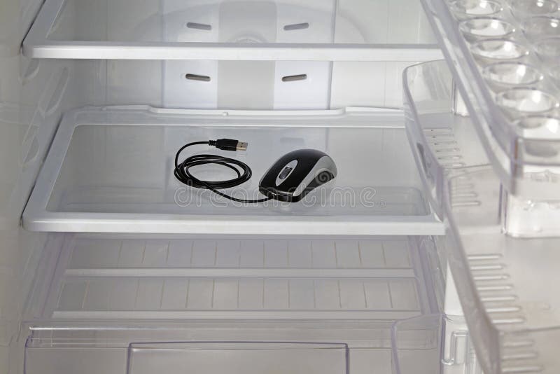 Dead Computer Mouse in an Empty Refrigerator. Poverty and Lack of Food ...