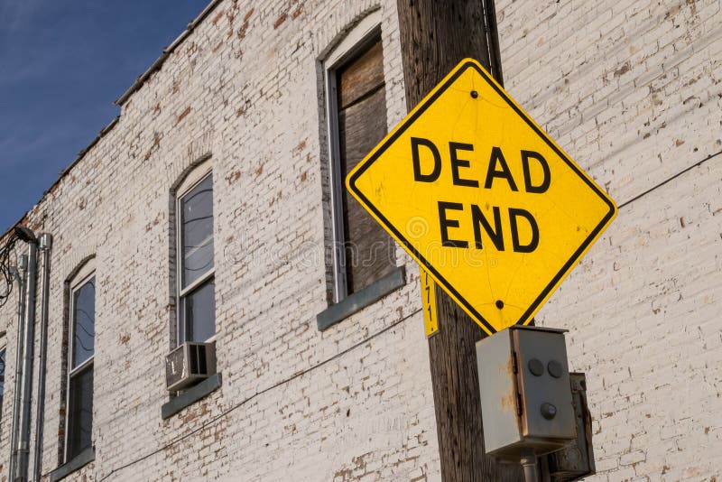 Brick Building With Dead End Sign Stock Photo - Image of closeup ...