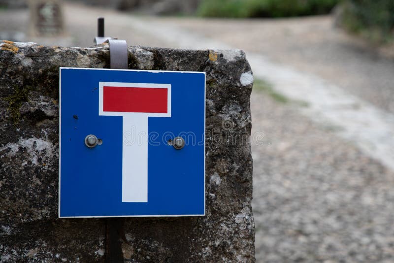 Dead End Street Road Sign Panel on Wall Street Stone Stock Photo ...