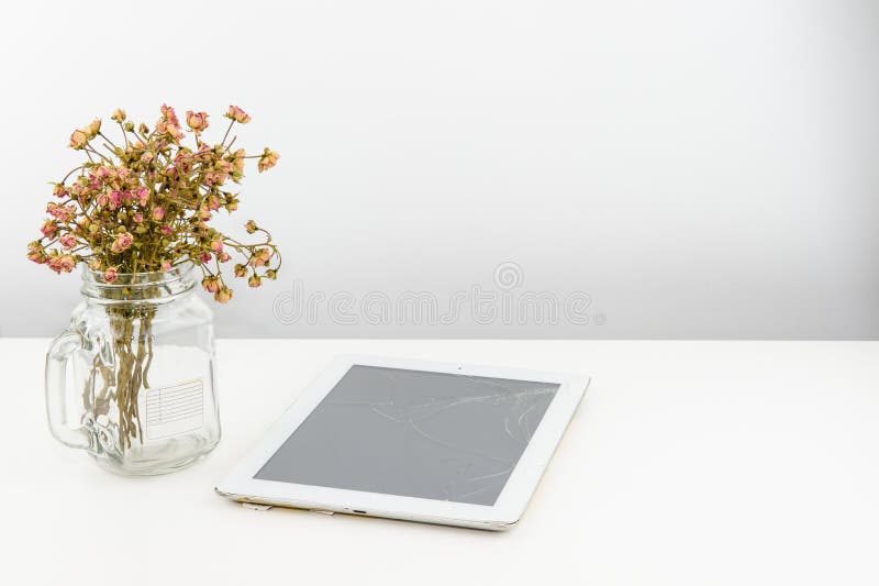 Tablet Screen Break with Dead Flower in Vase. Stock Photo - Image of ...