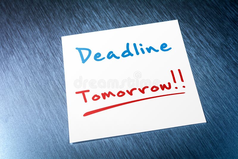 Deadline Sticky Note for Tomorrow on Paper on Brushed Aluminum of ...