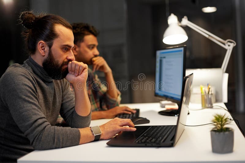 Creative Team with Computer Working Late at Office Stock Photo - Image ...