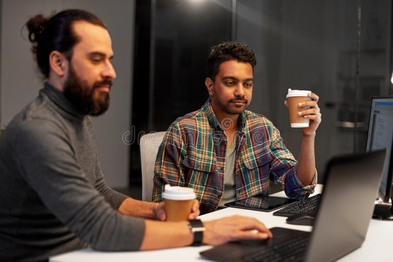 Creative Team Drinking Coffee at Night Office Stock Photo - Image of ...