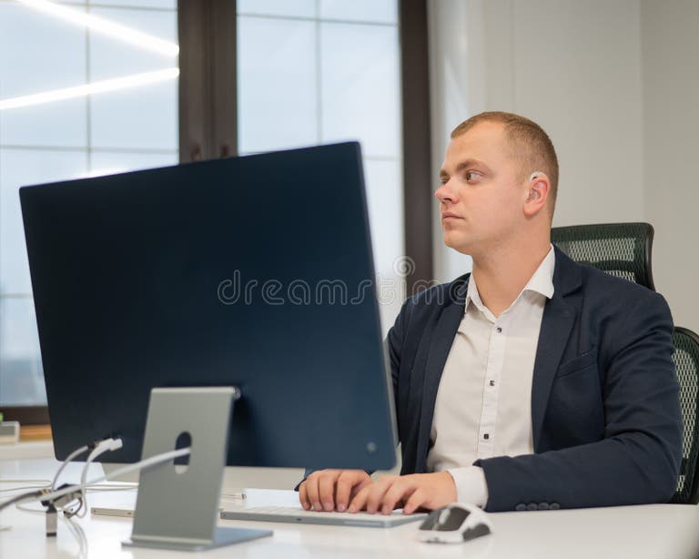 Deaf Man Working on a Computer in the Office. Stock Image - Image of ...