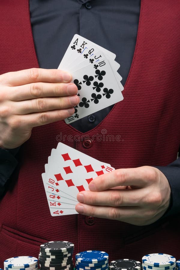 The Dealer`s Hands are Holding a Red and Black Combination of Winning ...
