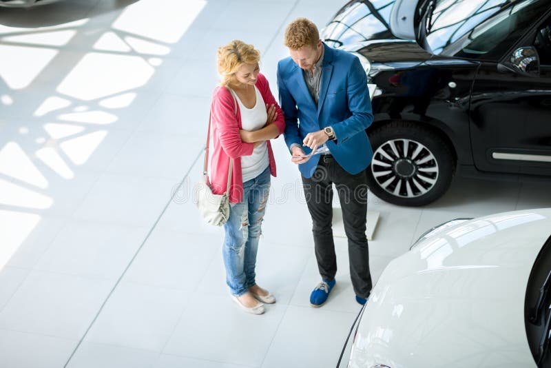 Dealer Speaking with a Client in a Dealership Stock Photo - Image of ...