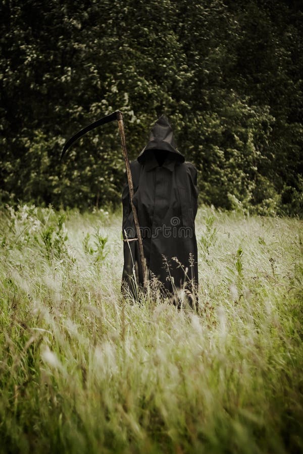 Death standing on a field stock photo. Image of black - 25432308