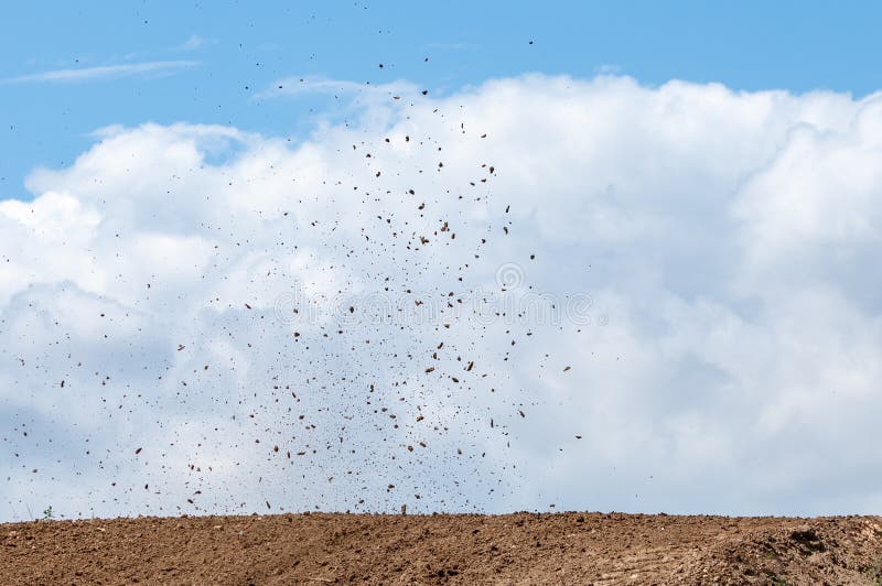 Debris Fly after Motocross Roaring Against Cloudy Sky. Stock Photo ...