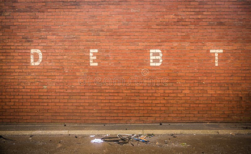 Debt on Red Brick Wall stock image. Image of credit, effect - 99638003