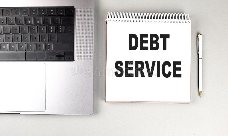 DEBT SERVICE Text on Notebook with Laptop and Pen Stock Photo - Image ...