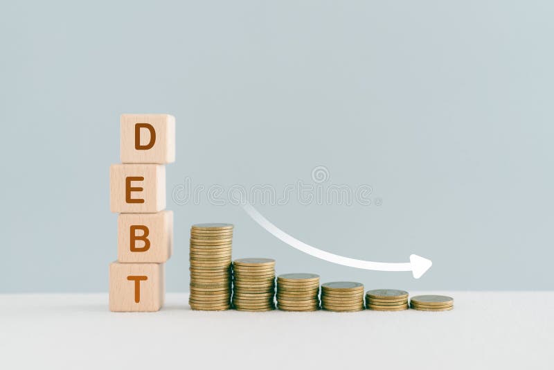 DEBT Word on Wooden Cube Blocks Word and Down Arrow with Stack of Coin for Financial Debt ...