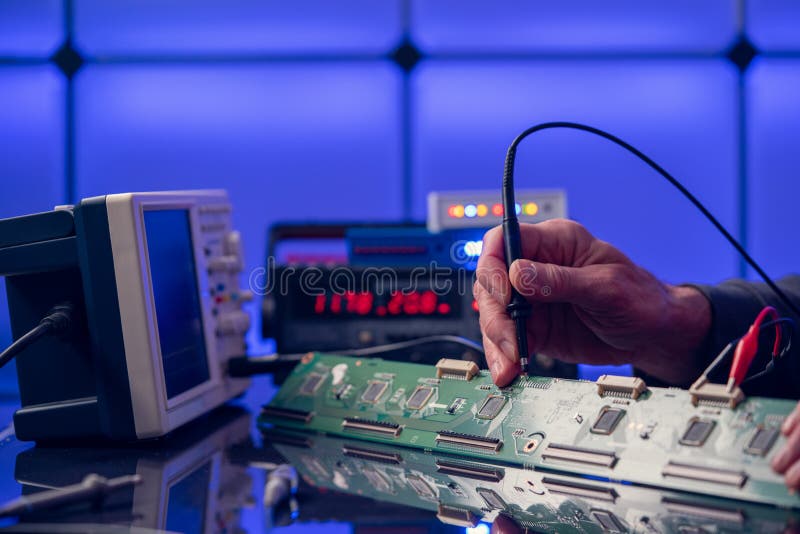 Debugging Electronics Device. PCB Witch Microcontroller in Electronics ...