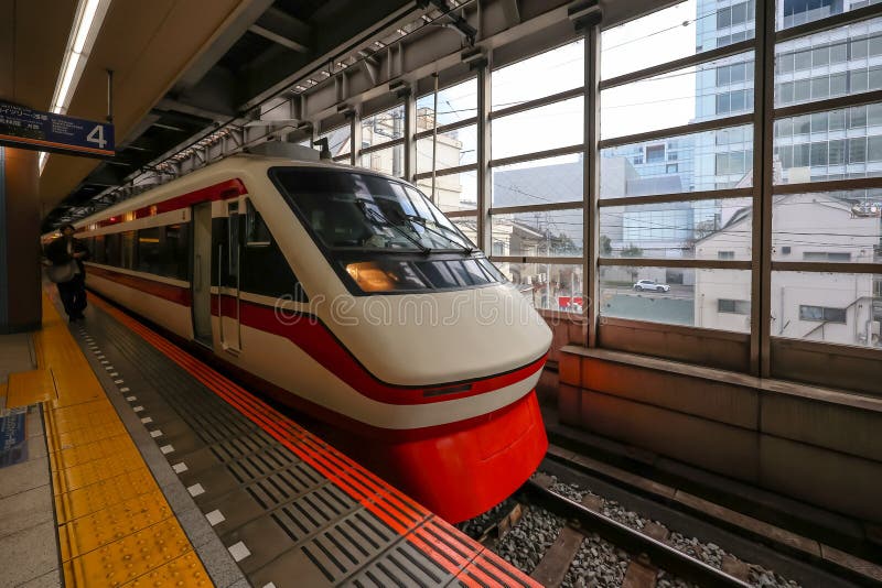 Dec 8 2024 Modern Red and White High-Speed Train at a Bright, Tokyo ...
