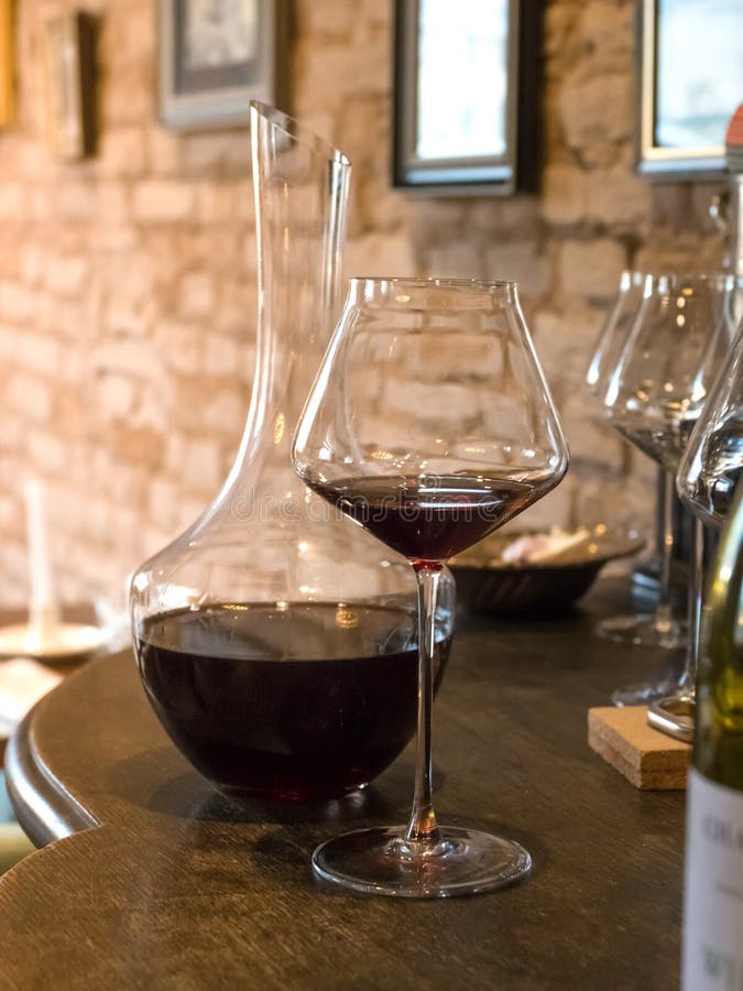 Decanting Old Wine. Red Wine in a Glass on the Bar Stock Image - Image ...