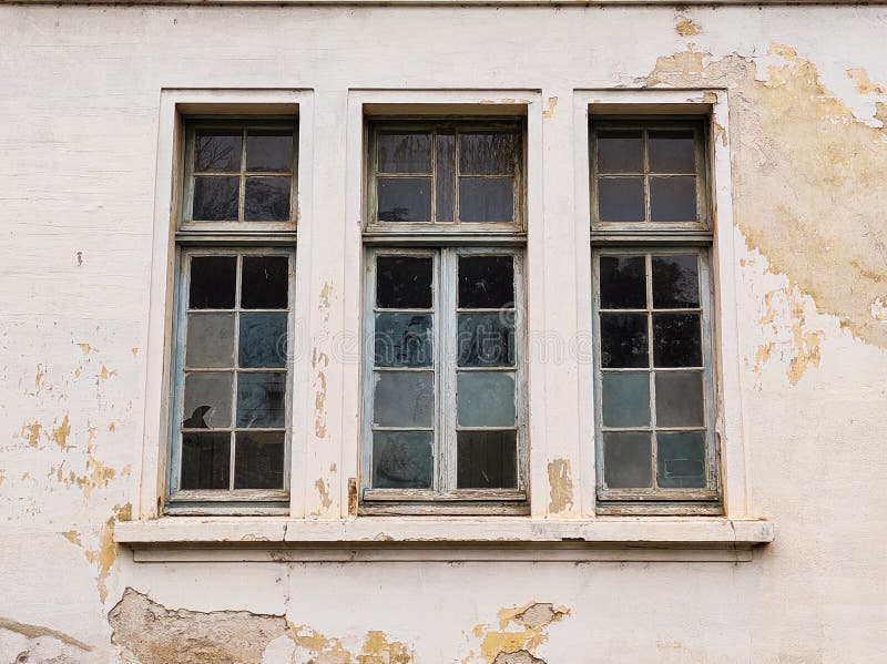 Decaying Glazed Windows of an Abandoned Building. Stock Image - Image ...