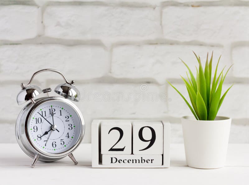 December, Alarm Clock and Calendar on the Table December 29 on a Wooden ...