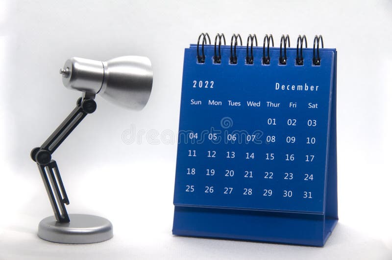 December 2022 Blue Desk Calendar on White Background with Table Lamp ...