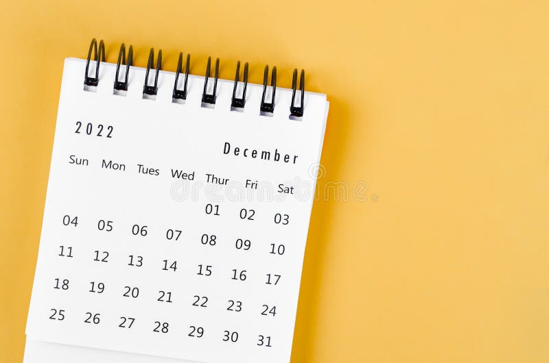 December 2022 Desk Calendar on Light Yellow Background Stock Photo ...