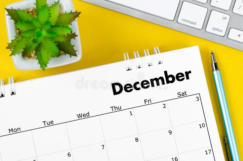 December 2022 Desk Calendar with Pen and Keyboard Computer on Yellow ...