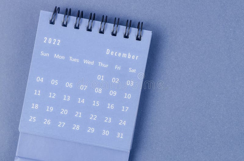 The December 2022 Monthly Desk Calendar for 2022 Year on Blue ...