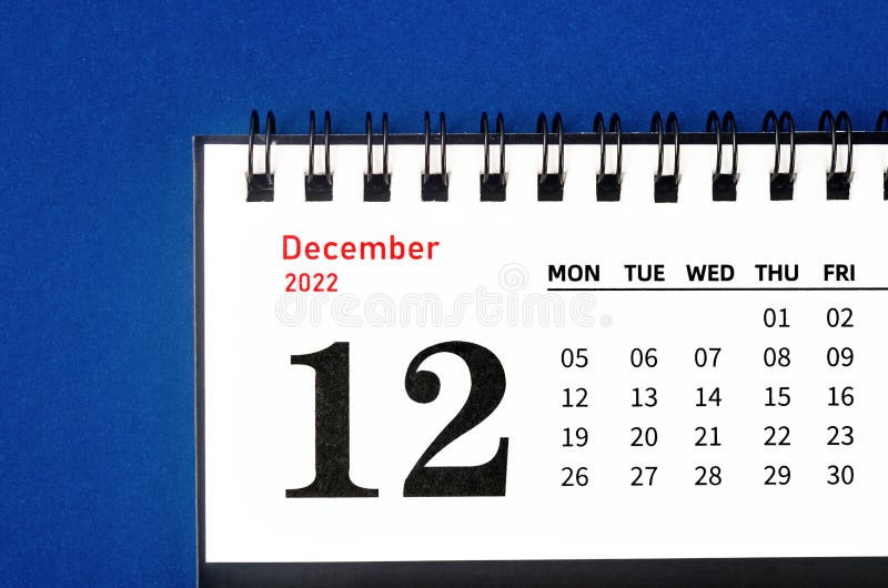 The December 2022 Monthly Desk Calendar for 2022 Year on Blue ...