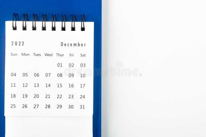 The December 2022 Monthly Desk Calendar for 2022 Year on Blue and White ...